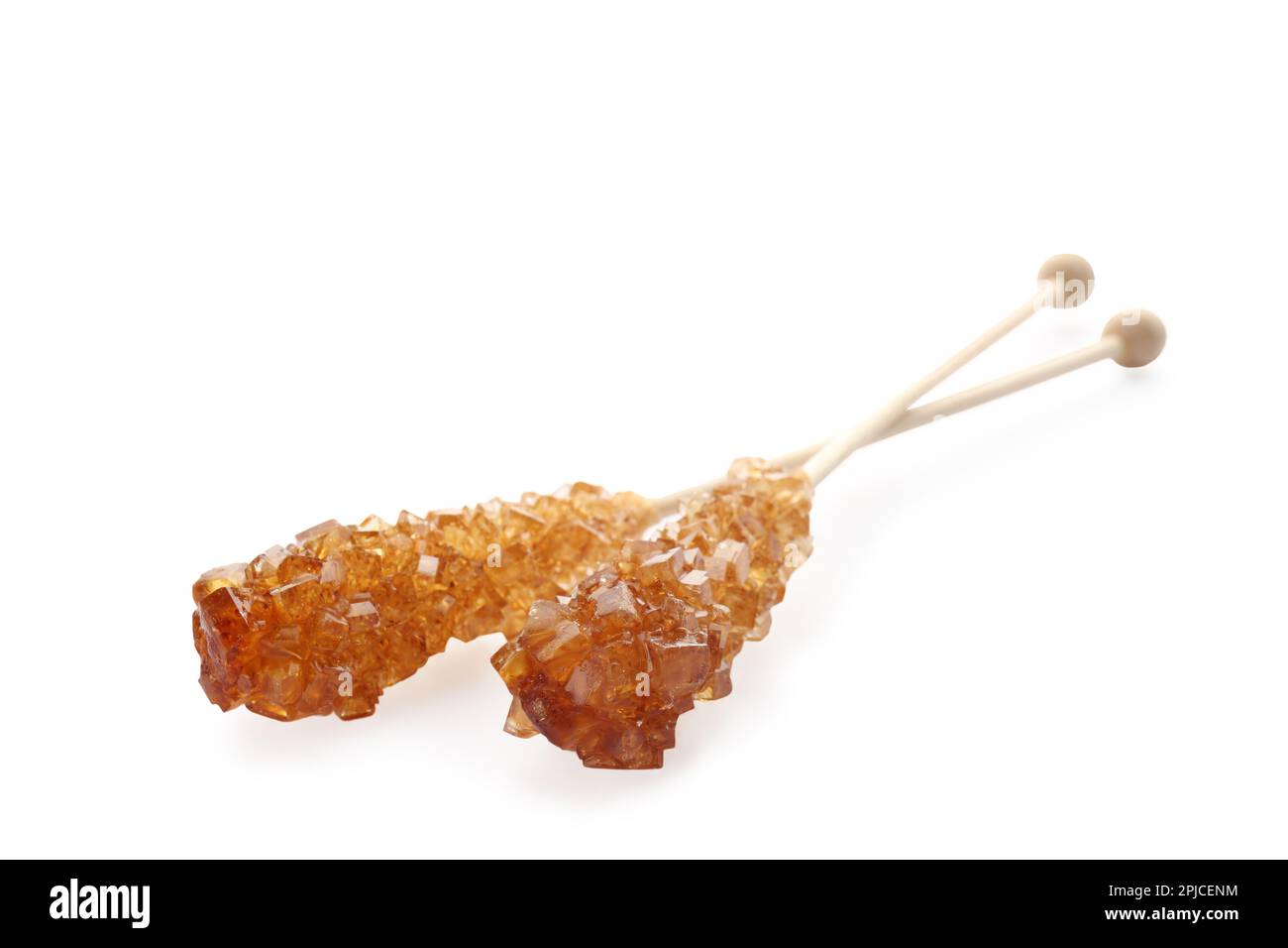 Wooden sticks with sugar crystals isolated on white. Tasty rock candies ...