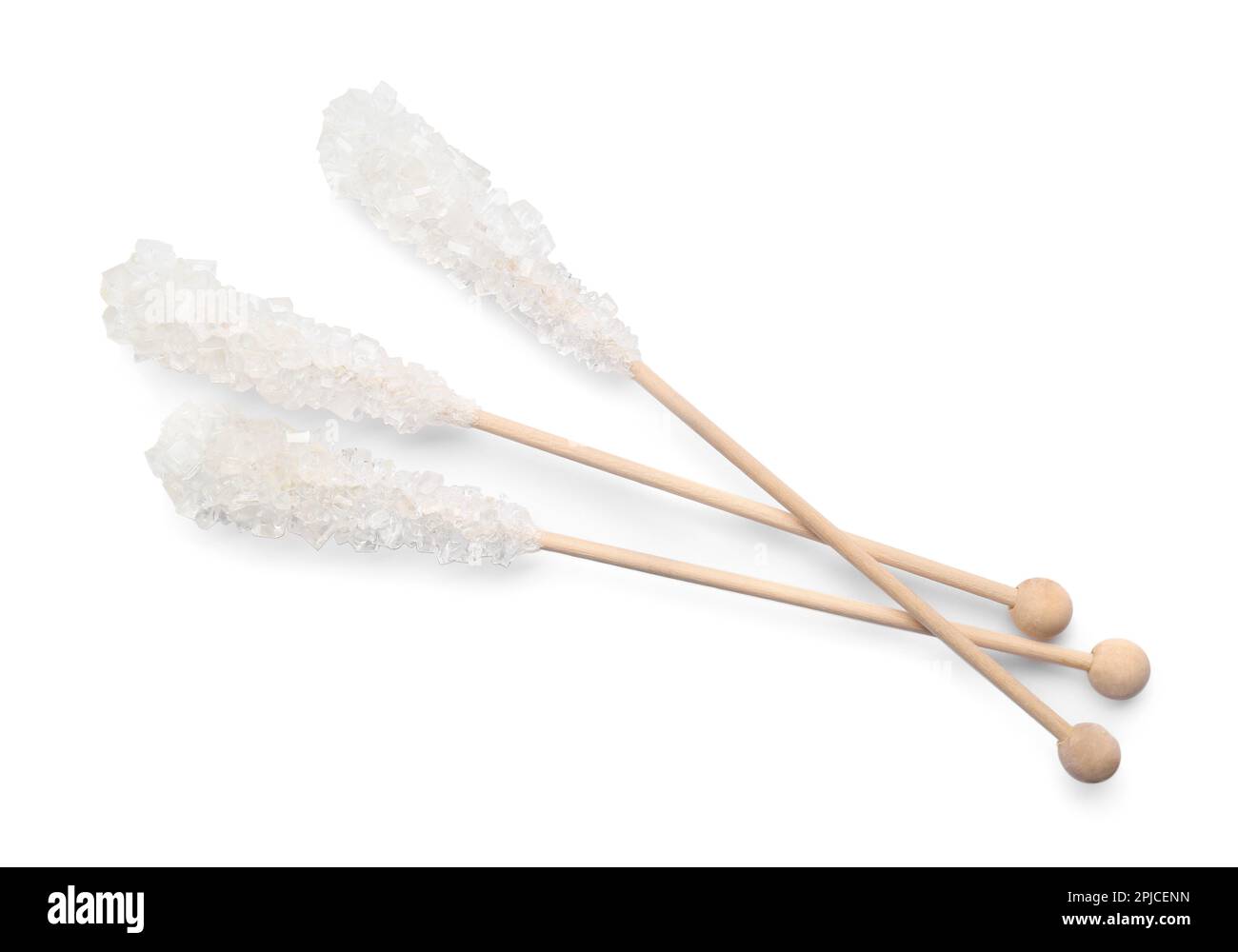 Wooden sticks with sugar crystals isolated on white, top view. Tasty ...