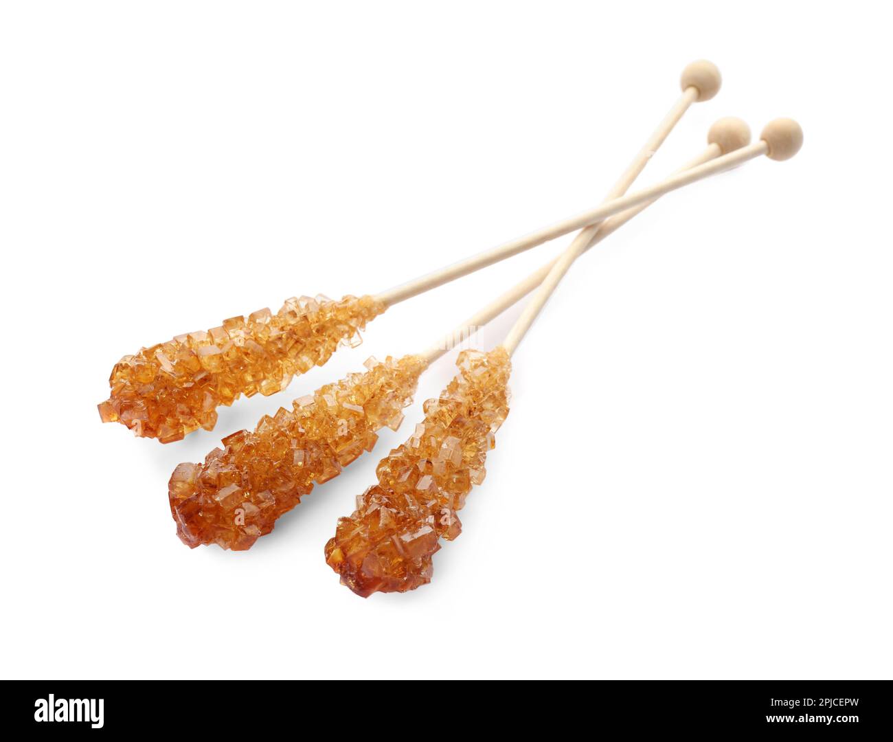 Wooden sticks with sugar crystals isolated on white. Tasty rock candies ...
