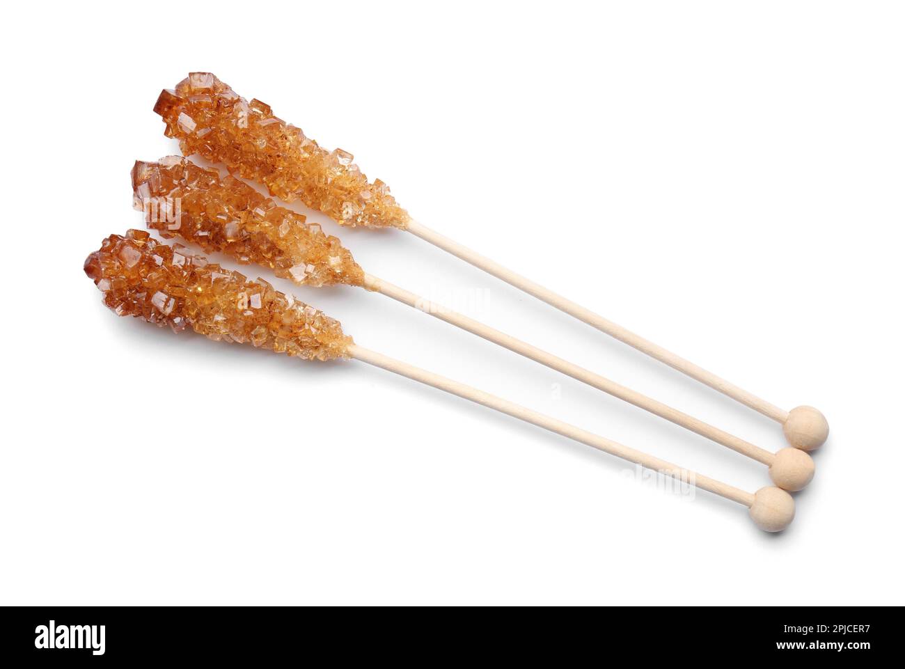 Wooden sticks with sugar crystals isolated on white, top view. Tasty ...