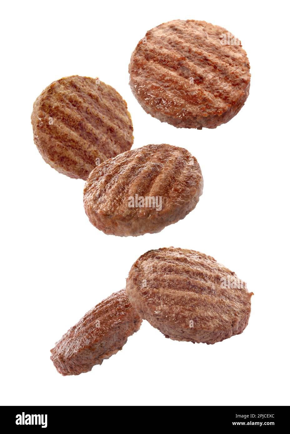 Tasty grilled hamburger patties falling on white background Stock Photo ...