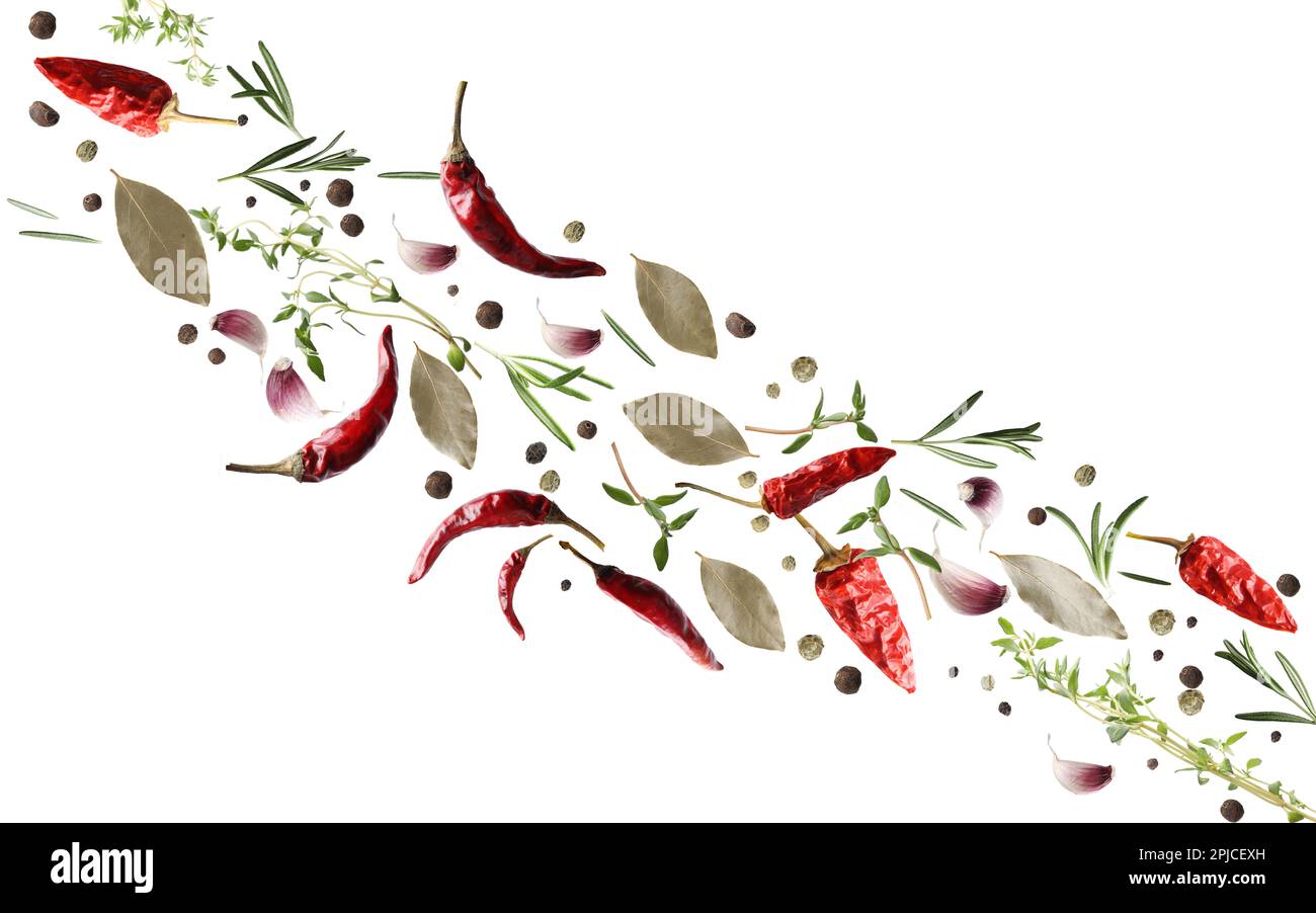 Many different spices flying on white background Stock Photo - Alamy