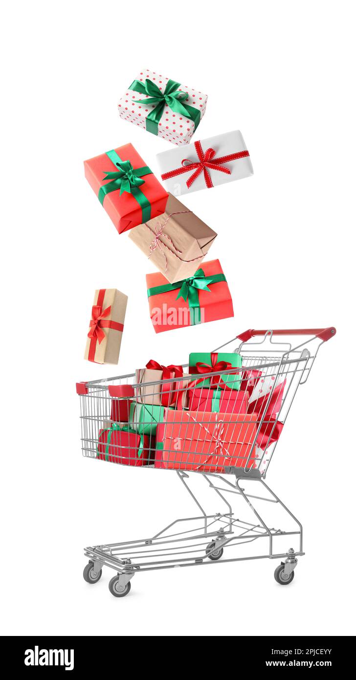 Beautifully wrapped gift boxes falling into metal shopping cart on ...