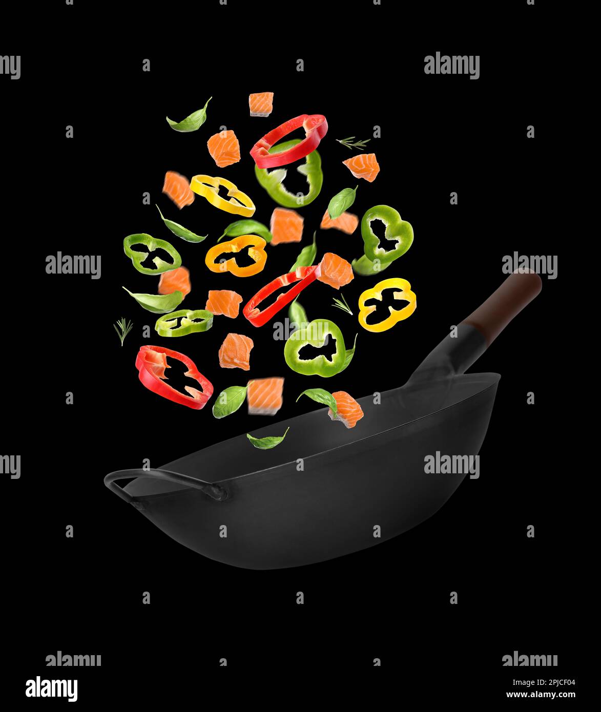 Different tasty ingredients falling into wok on black background Stock ...