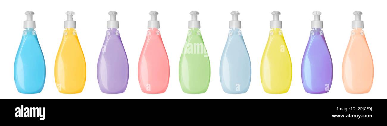 Set with bottles of multicolored liquid soap on white background ...