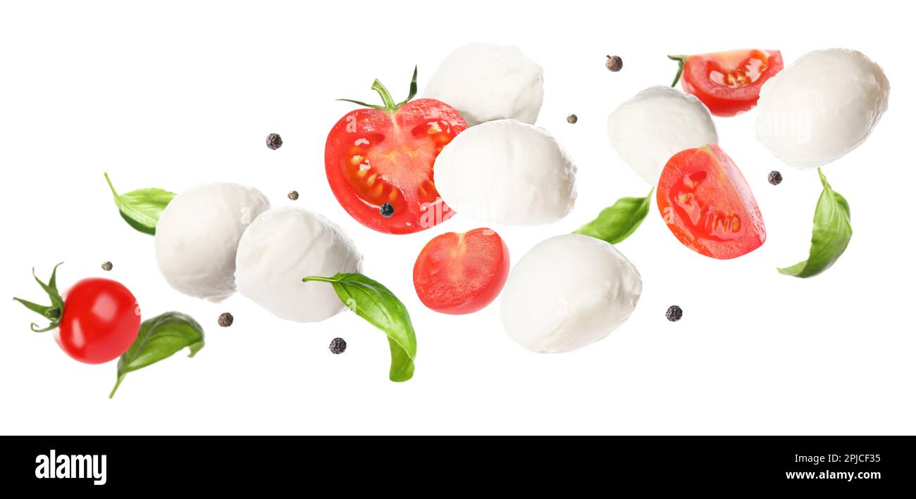 Mozzarella cheese balls, tomatoes, basil leaves and peppercorns for ...