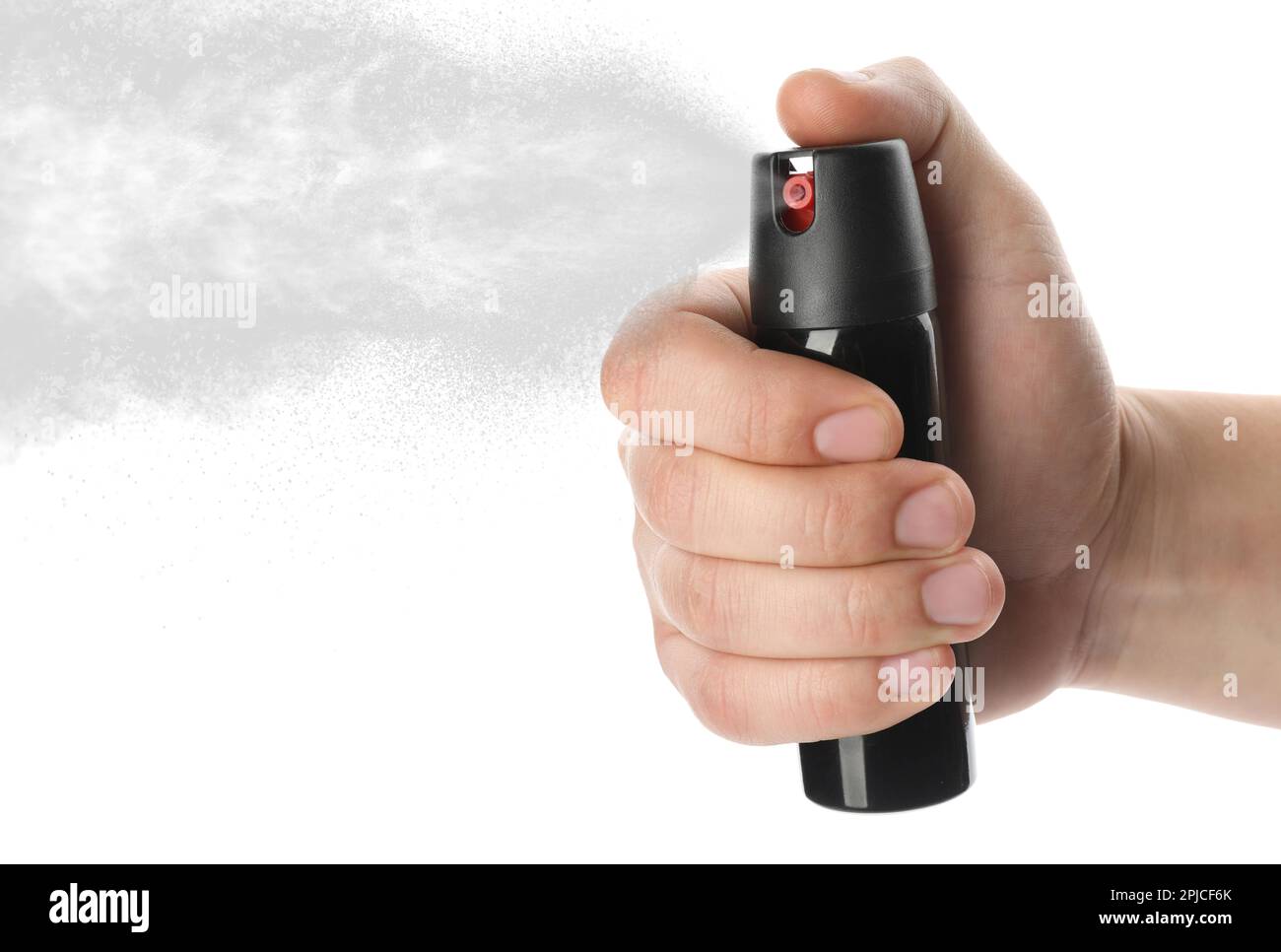 Man using pepper spray on white background, closeup Stock Photo - Alamy