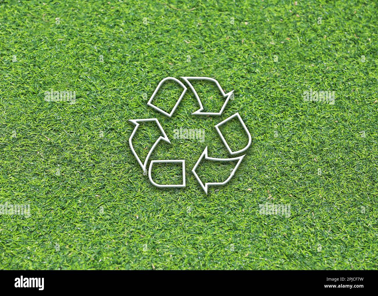Green grass and illustration of recycling symbol Stock Photo - Alamy