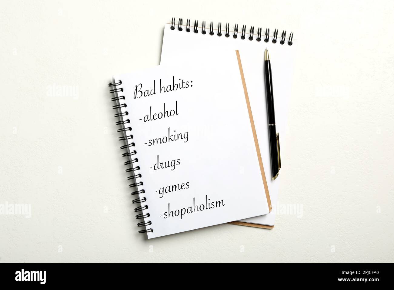 Notebook with list of bad habits on white table, flat lay Stock Photo ...