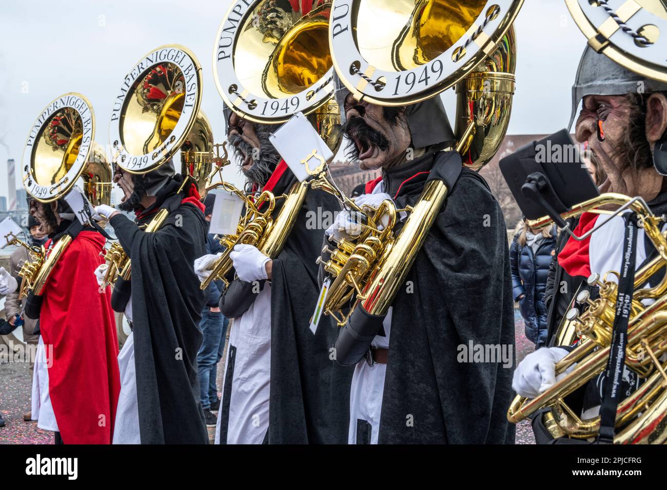 brass tuba players at the Basel Switzerland Carnival or Fasnacht parade ...