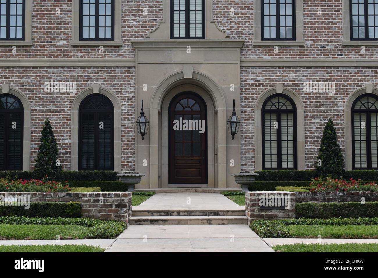 A portrait the entrance of a luxurious and traditional mansion in ...