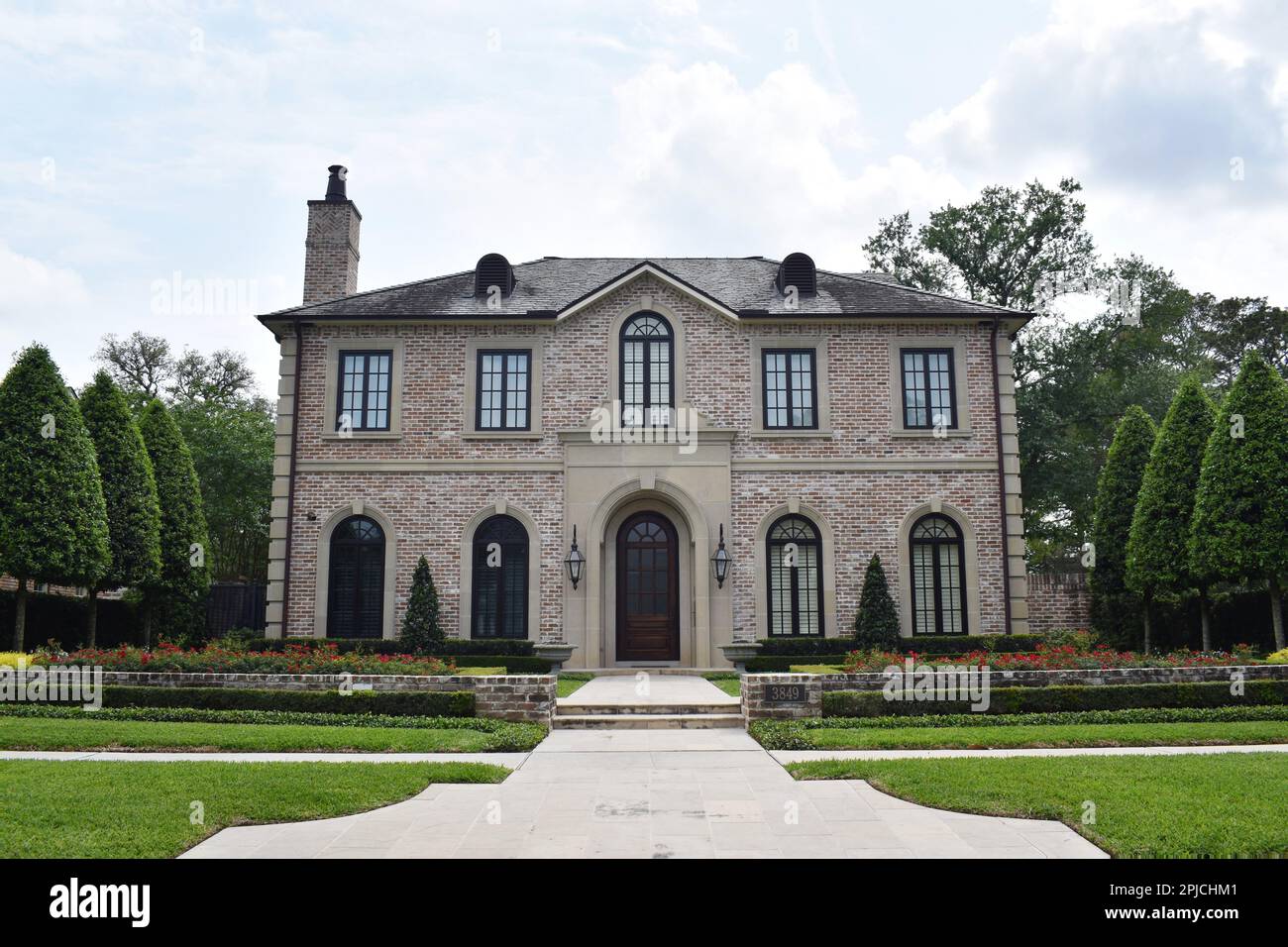A portrait of a luxurious and traditional mansion in Houston, TX Stock ...