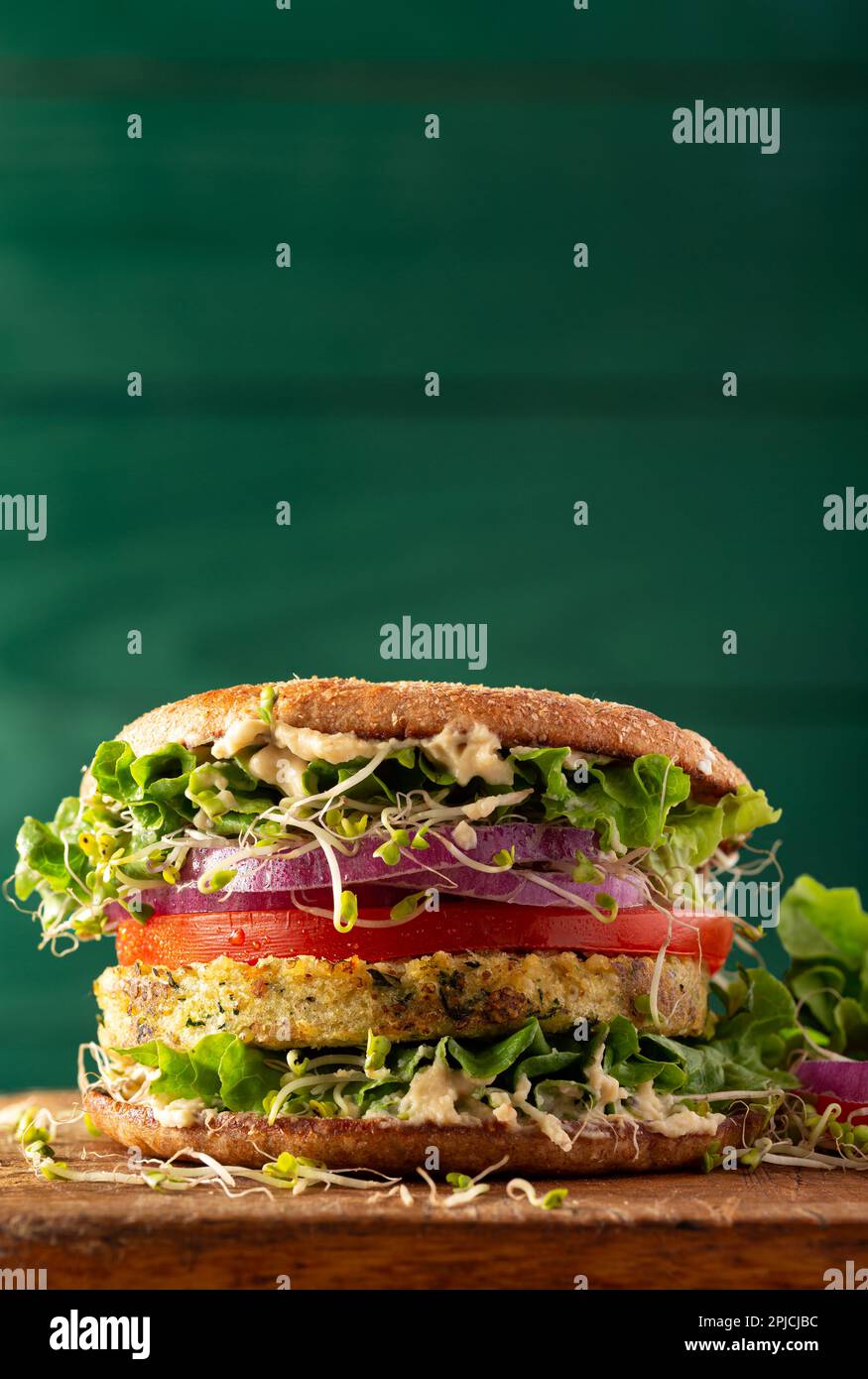 Garden burger made from cauliflower on a skinny bun with broccoli ...