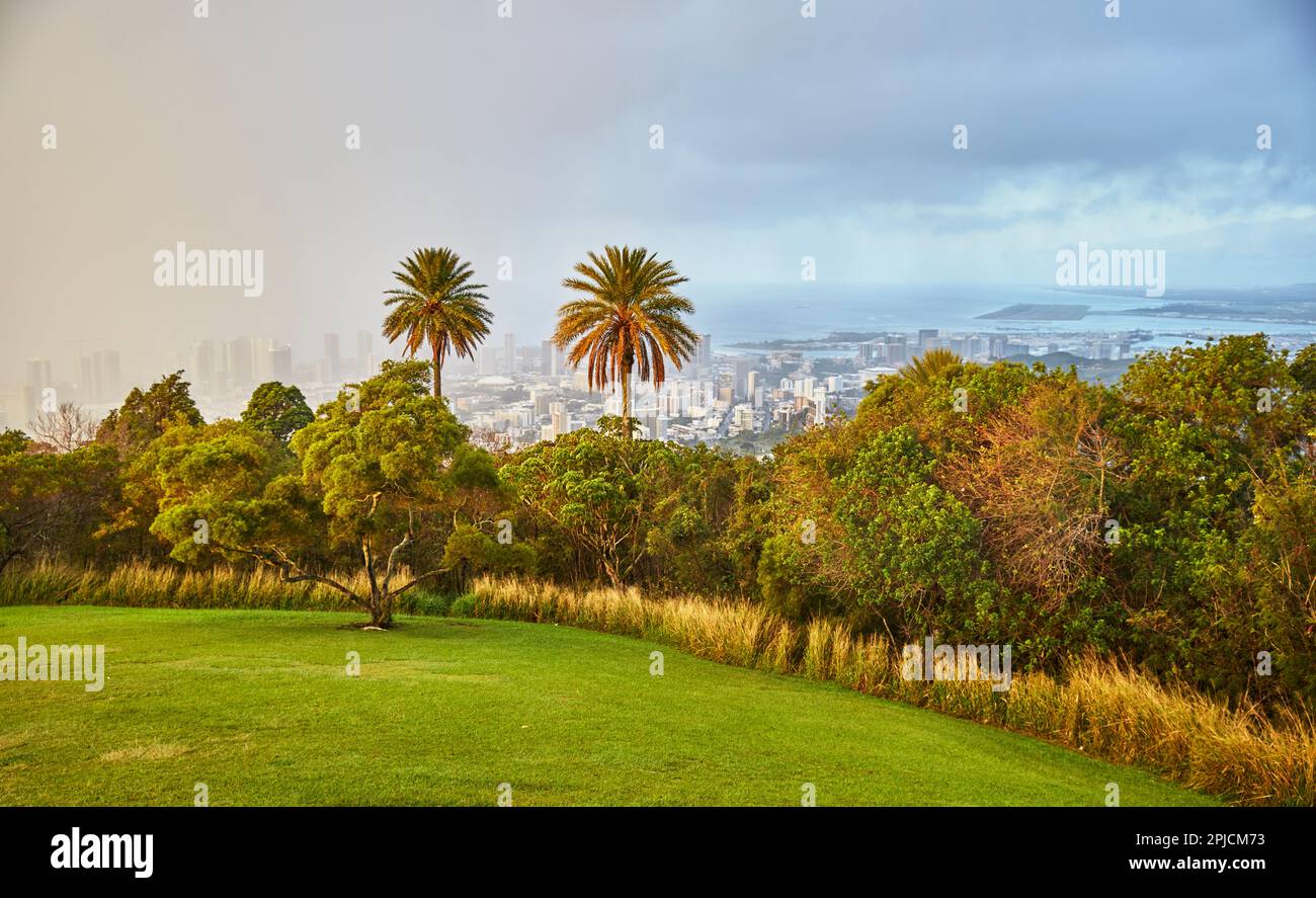 View overlooking Honolulu, Hawaii during a Rainy Sunrise Stock Photo ...