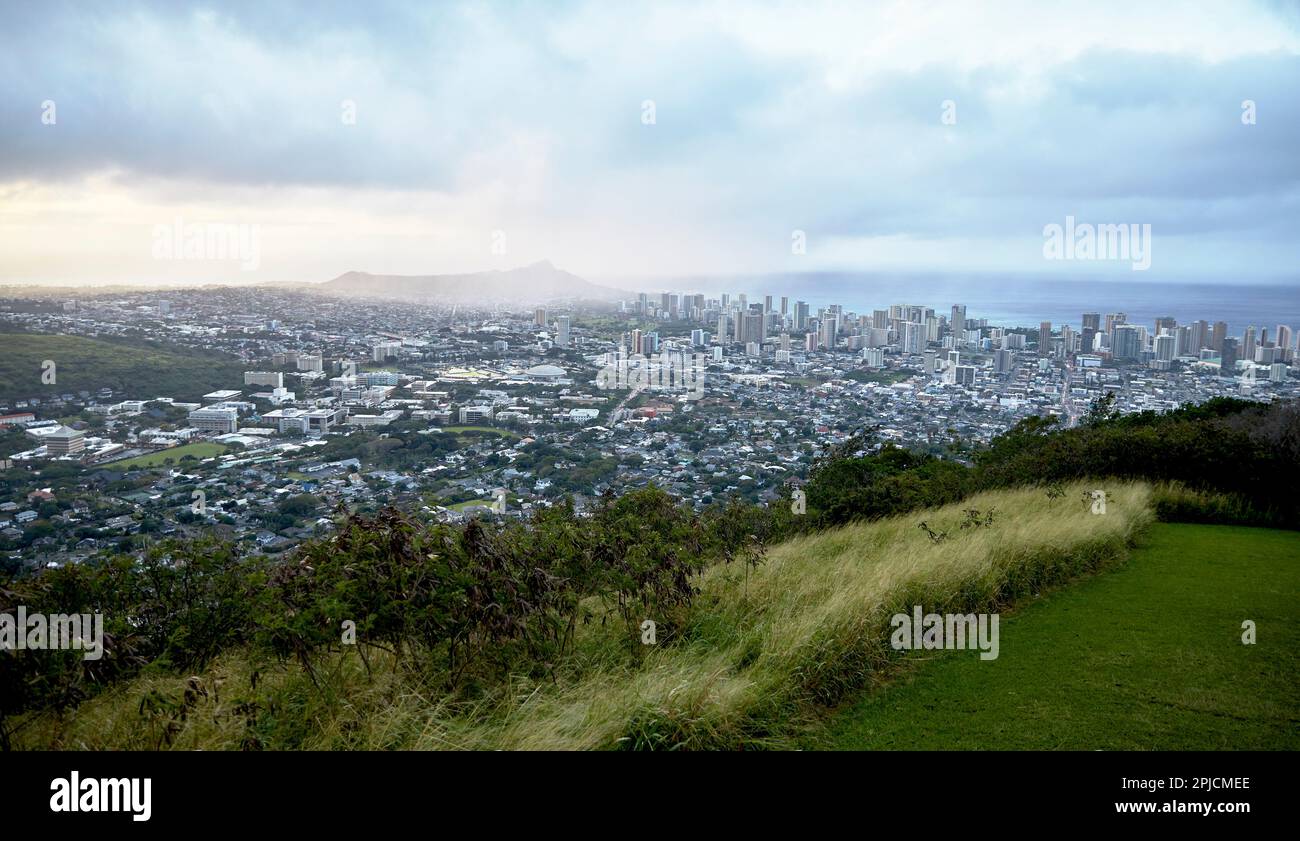 View overlooking Honolulu, Hawaii during a Rainy Sunrise Stock Photo ...