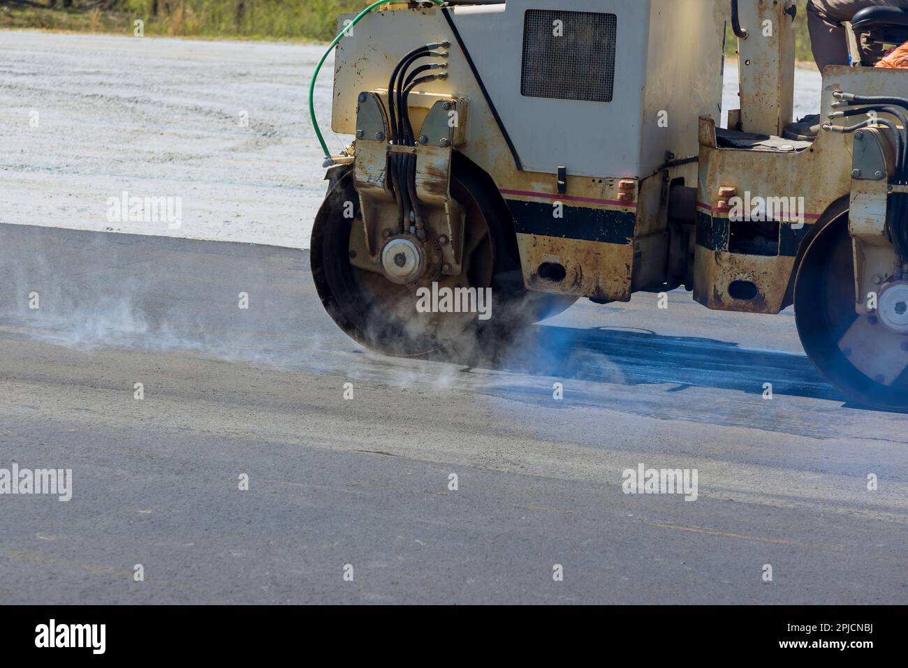 It is process of asphalting road by using asphalt special machines that ...