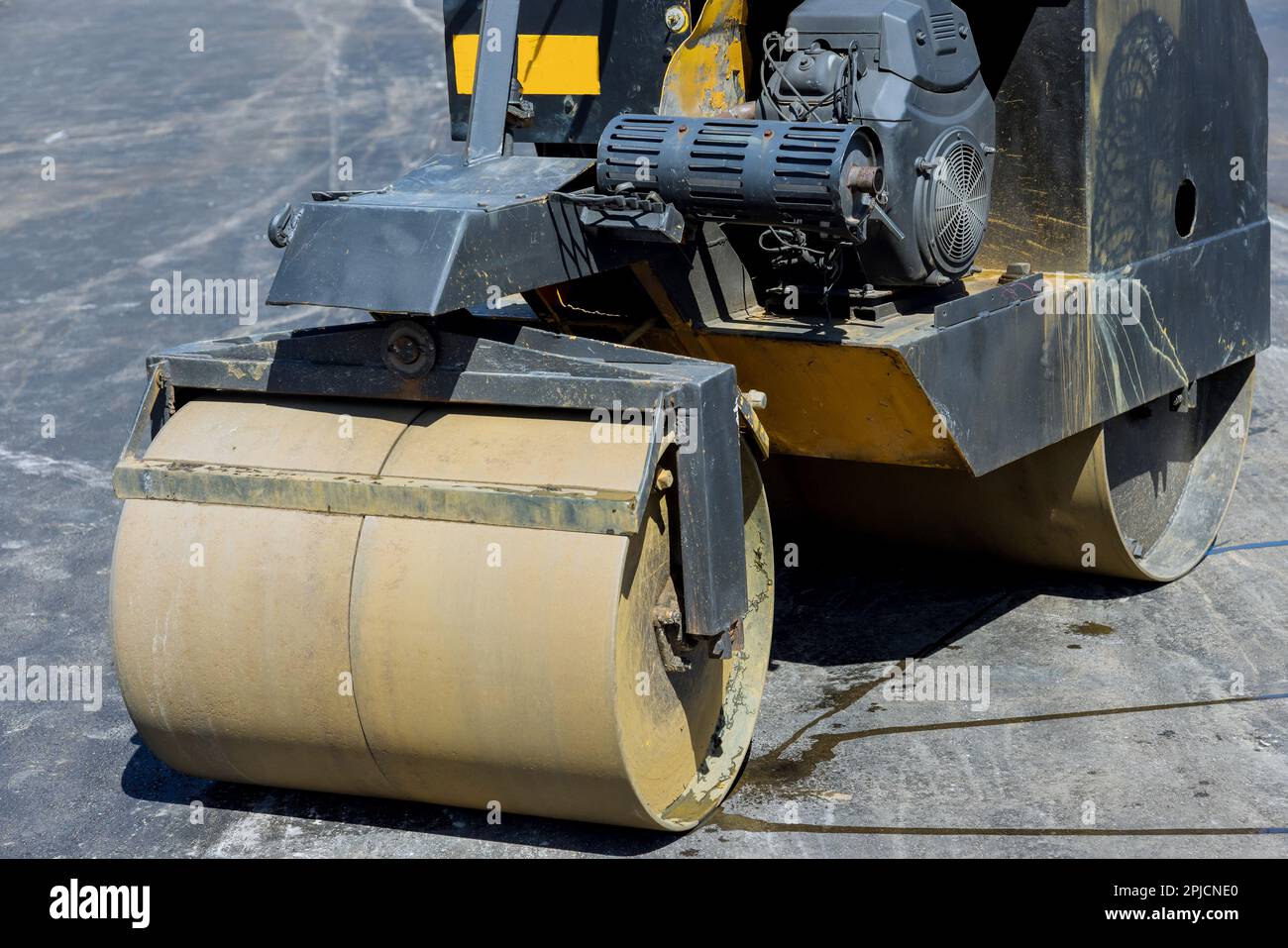Construction worker in vibratory plate compactor process machine ...