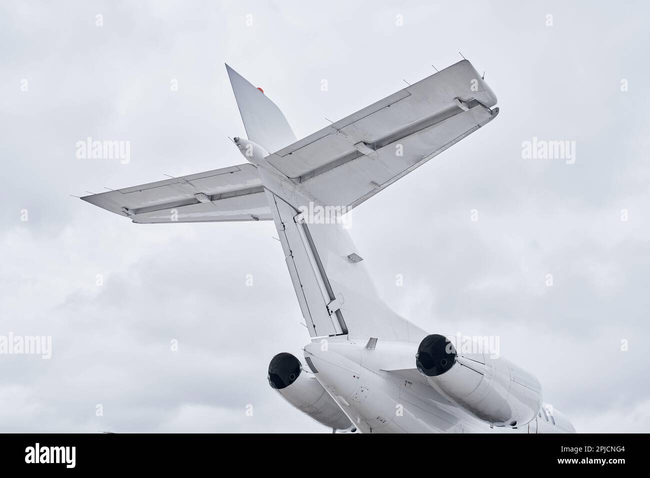White plane. Turboprop aircraft parked on the runway at daytime Stock ...