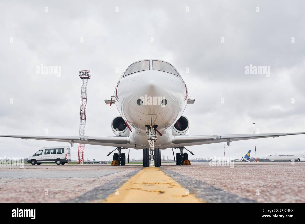 Front view. Turboprop aircraft parked on the runway at daytime Stock ...