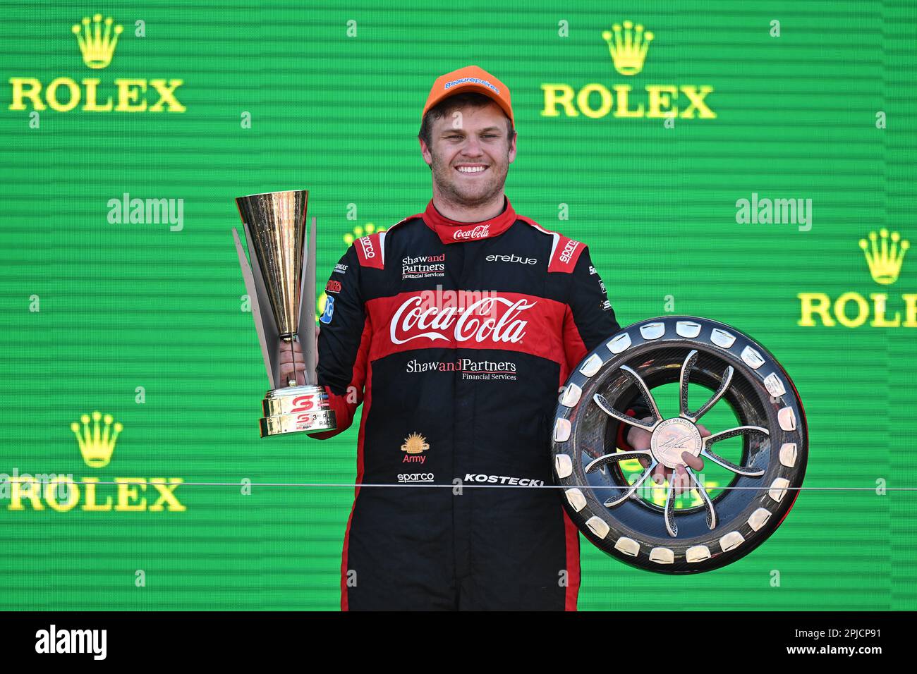 Brodie Kostecki of Coca-Cola Racing celebrates on the podium following ...