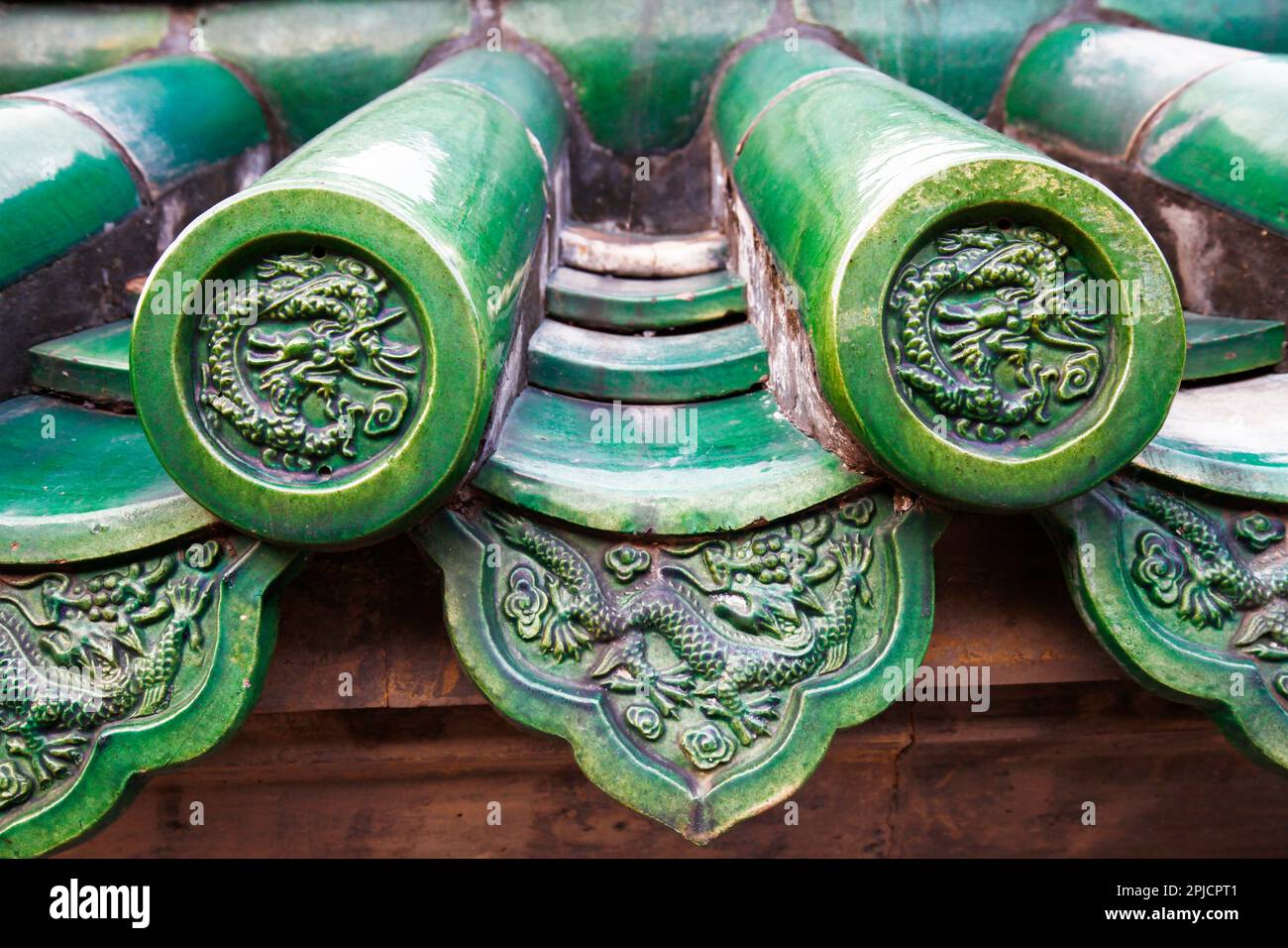 On the wall green glazed tiles as the background, the traditional ...