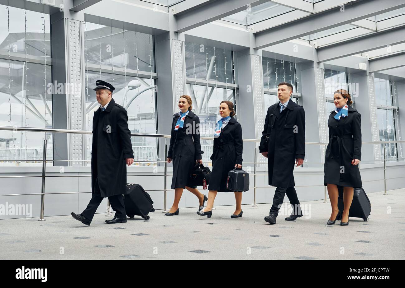 Airplane crew in uniform is going to the work together Stock Photo - Alamy