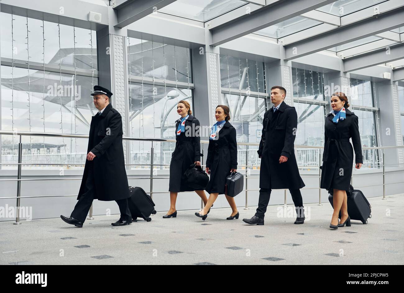 Airplane crew in uniform is going to the work together Stock Photo - Alamy