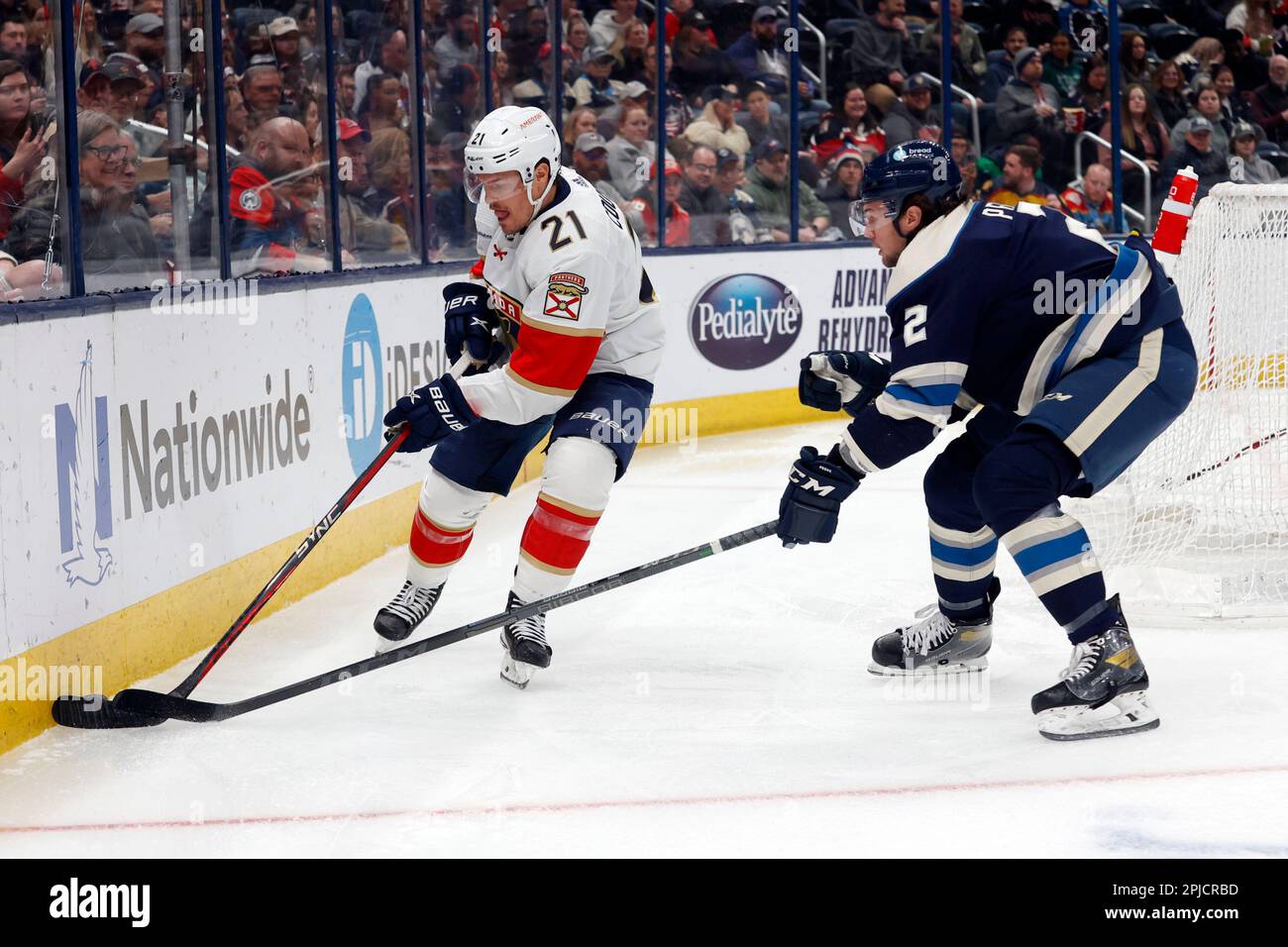 Florida Panthers forward Nick Cousins, left, controls the puck in front ...