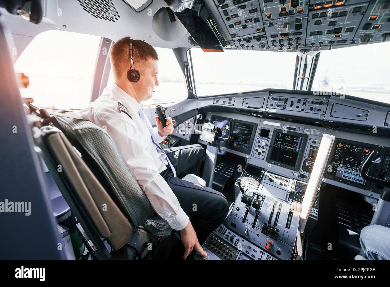 Pilot on the work in the passenger airplane. Preparing for takeoff ...