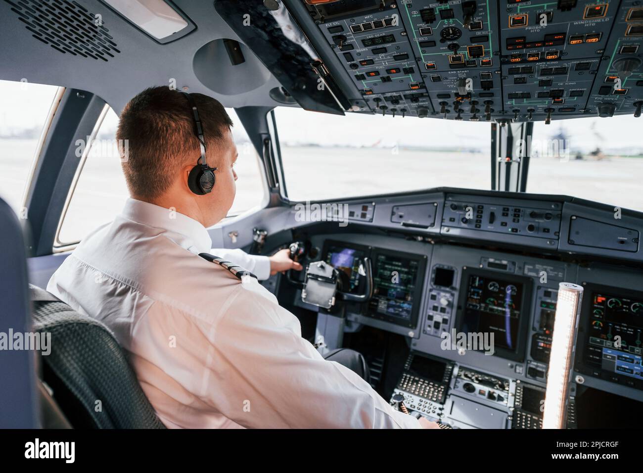 Pilot on the work in the passenger airplane. Preparing for takeoff ...