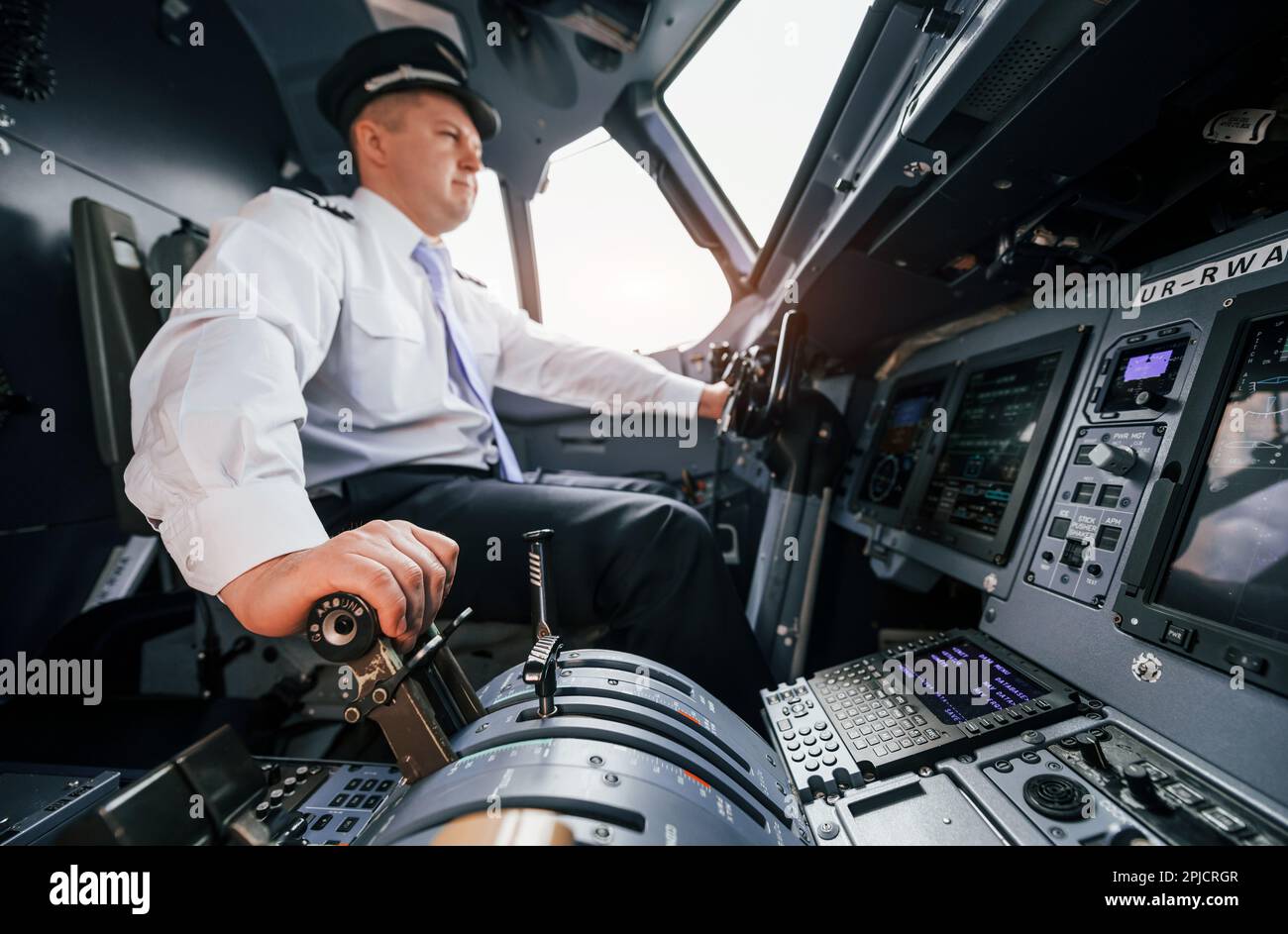Professional airplane captain preparing flight hi-res stock photography ...