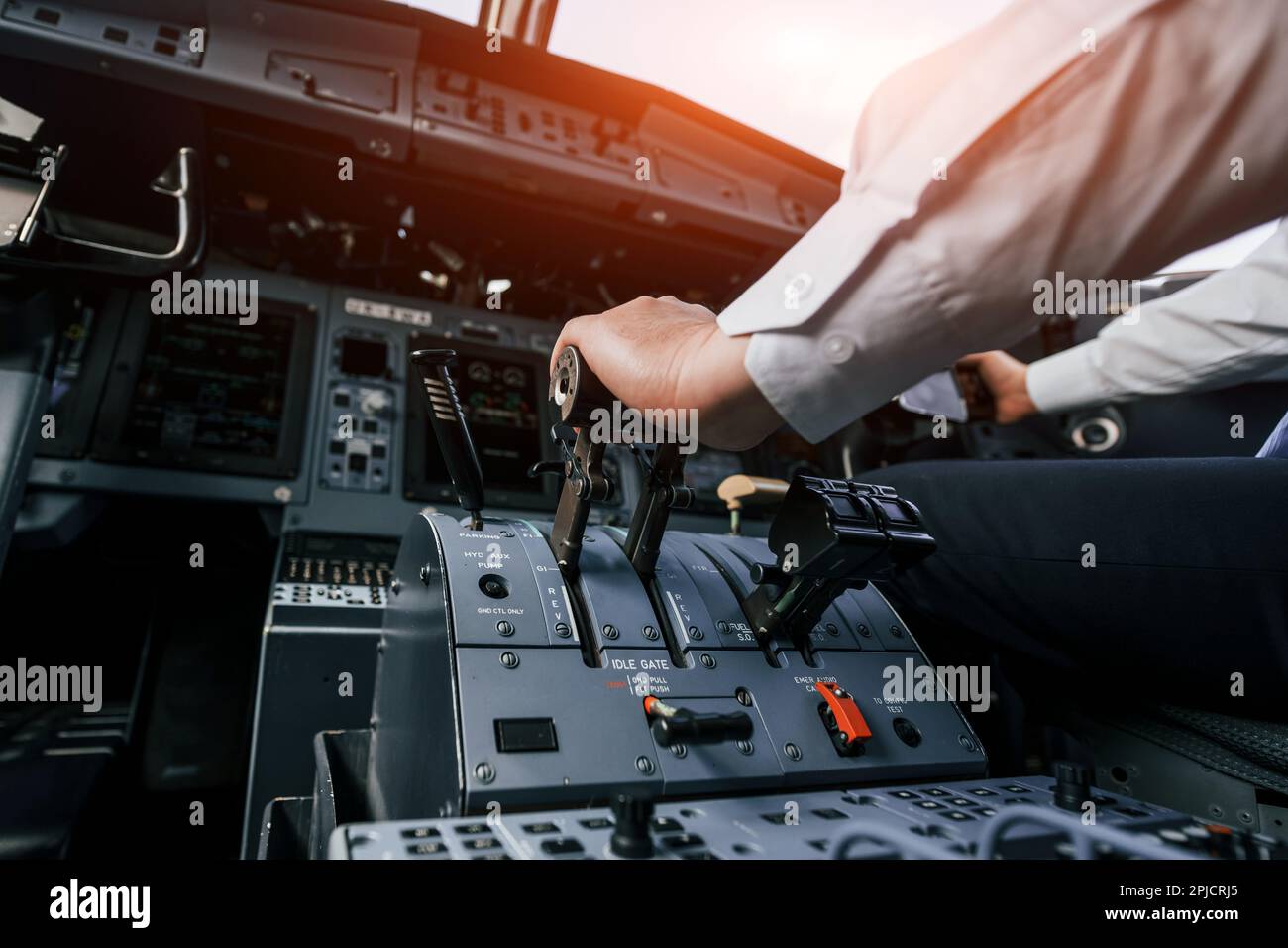 Control of the flight. Pilot on the work in the passenger airplane ...