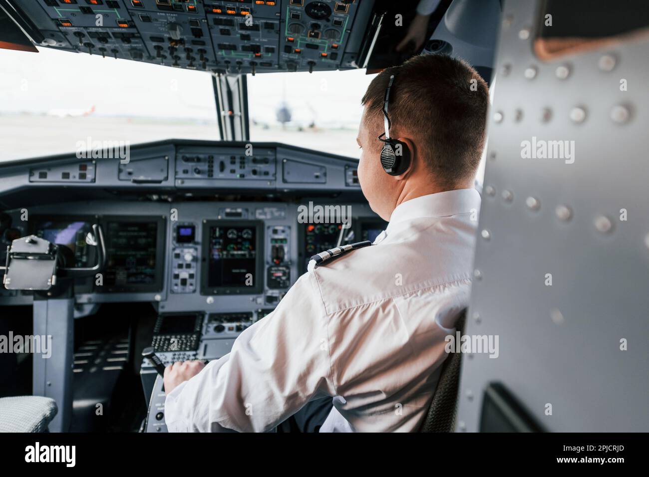 Pilot on the work in the passenger airplane. Preparing for takeoff ...
