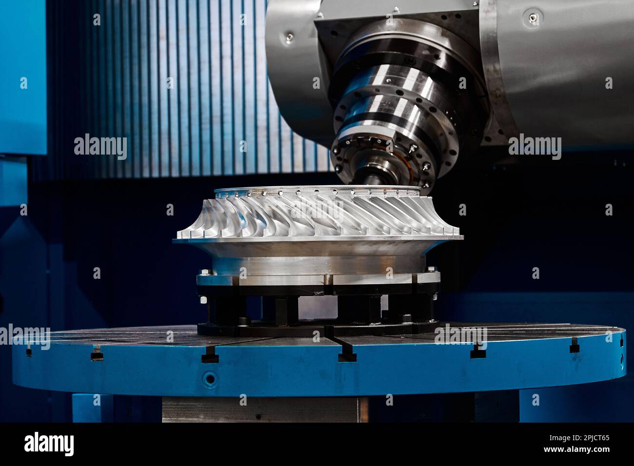 Five-axis milling machine makes turbine wheel at plant Stock Photo - Alamy