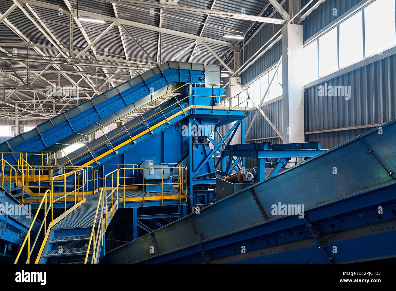 Large production line with conveyors carrying trash at plant Stock Photo - Alamy