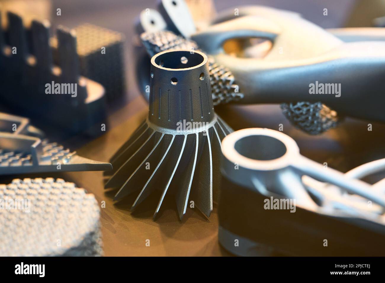 Metal part of rotor detail with thin blades on wooden table Stock Photo ...