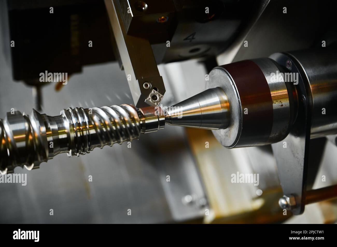 Milling machine tool operates with metal workpiece at plant Stock Photo ...