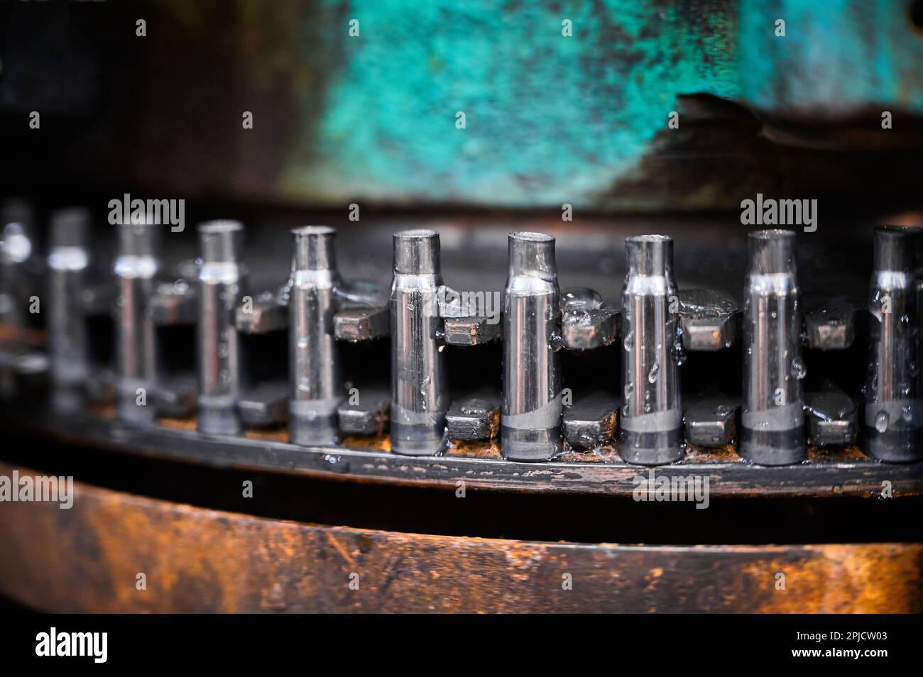 Shell casings transported by vintage equipment at plant Stock Photo - Alamy