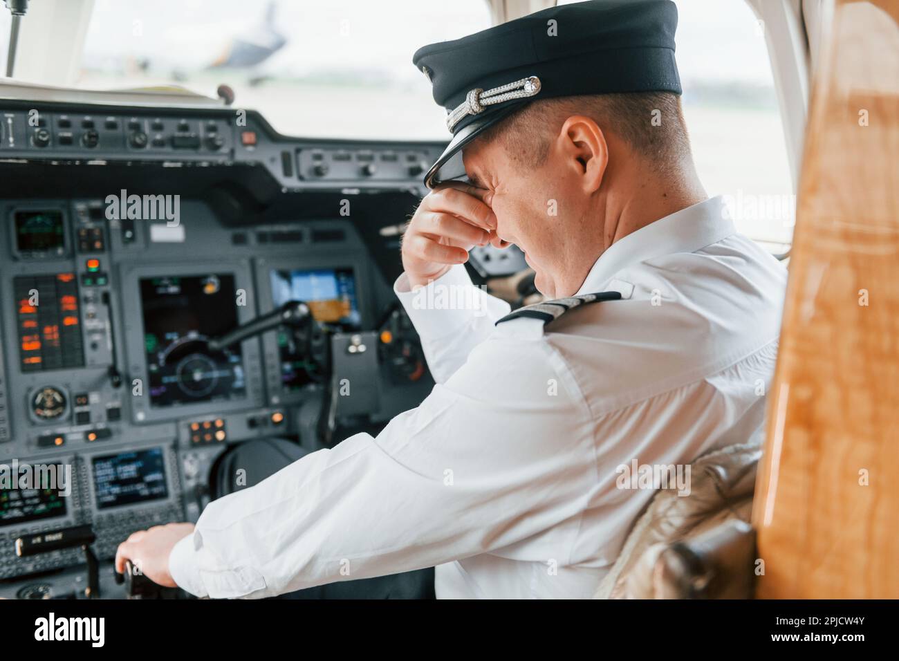 Pilot on the work in the passenger airplane. Preparing for takeoff ...