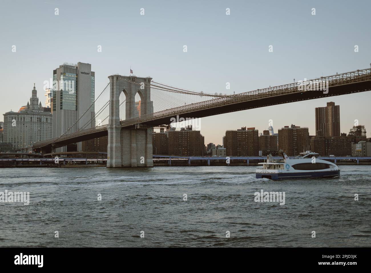 View of the Brooklyn Bridge and ferry on the East River, Brooklyn, New ...