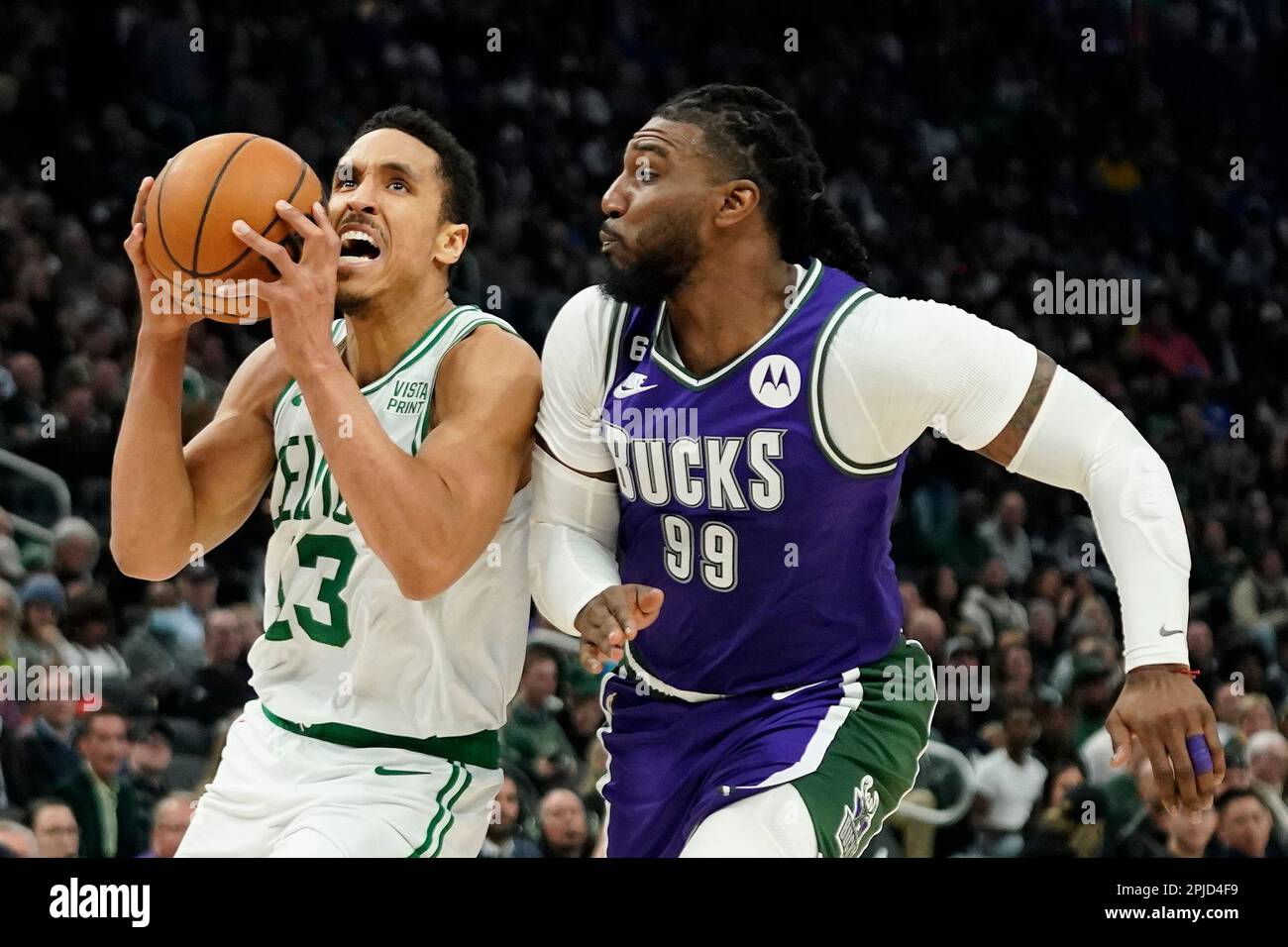 Boston Celtics' Malcolm Brogdon (13) drives to the basket against ...