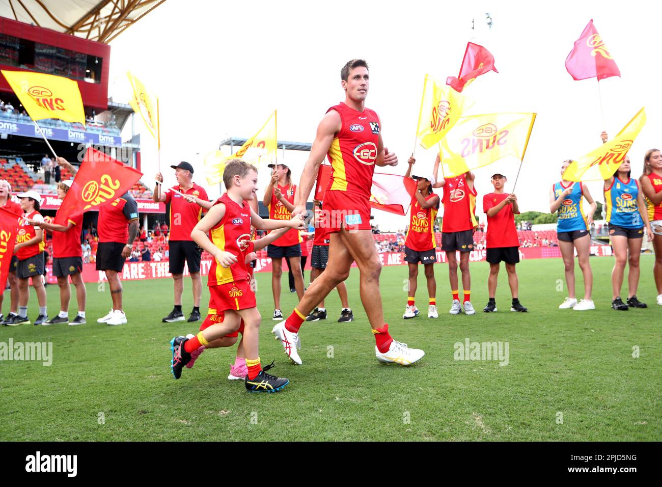 David Swallow of the Suns runs out for his 200th game during the AFL ...