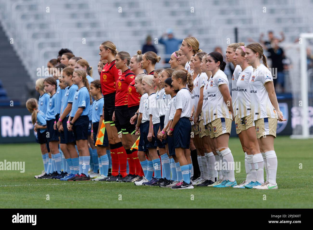 Sydney FC, Referees and Newcastle Jets line up on the field before the ...