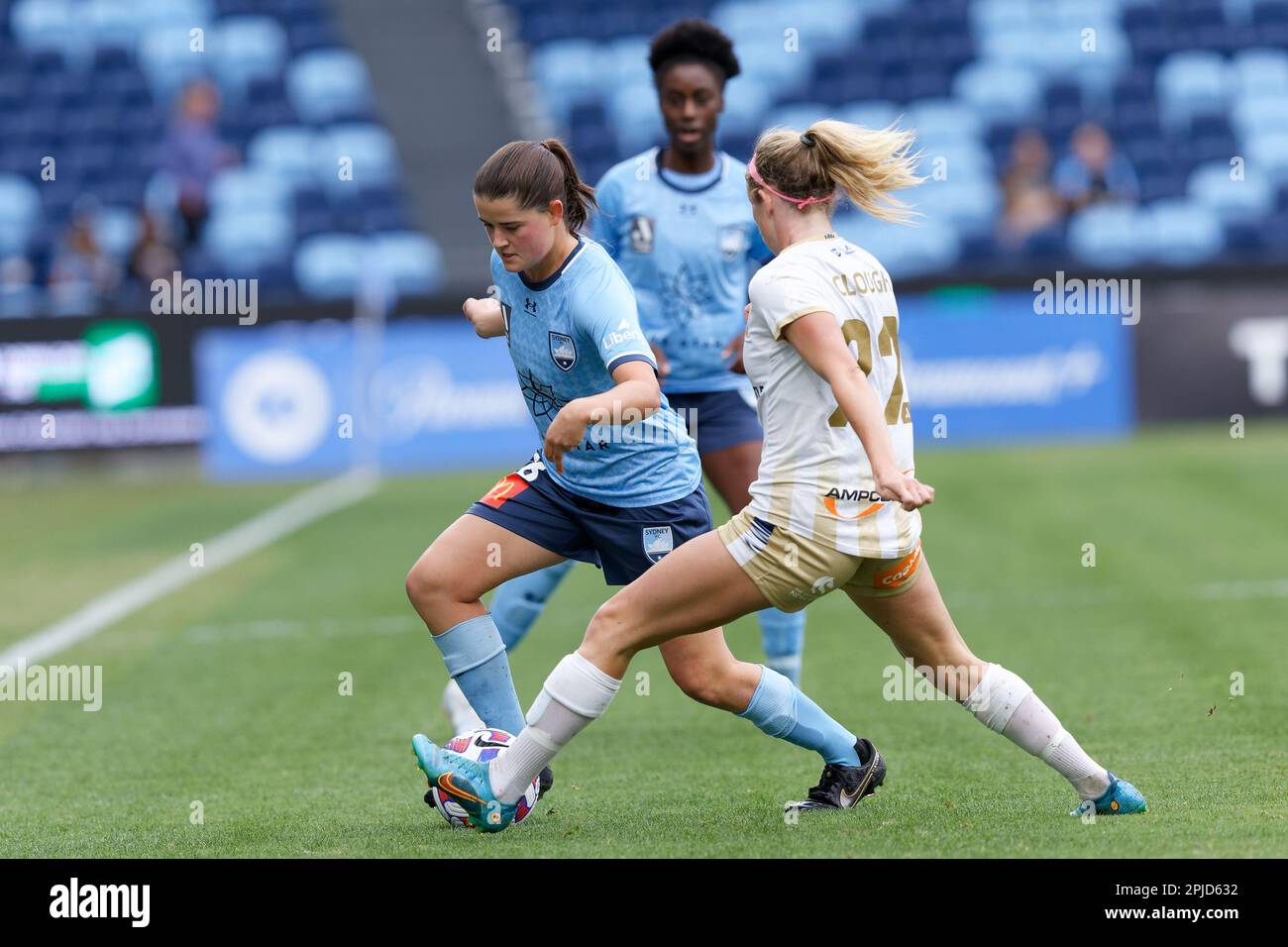 Cannon Clough of Newcastle competes for the ball with Rachel Lowe of ...
