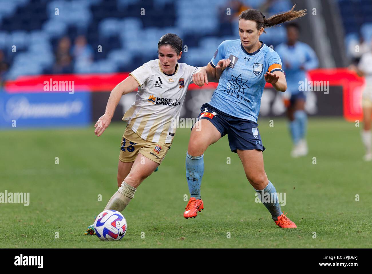 Natalie Tobin of Sydney competes for the ball with Lauren Allan of ...
