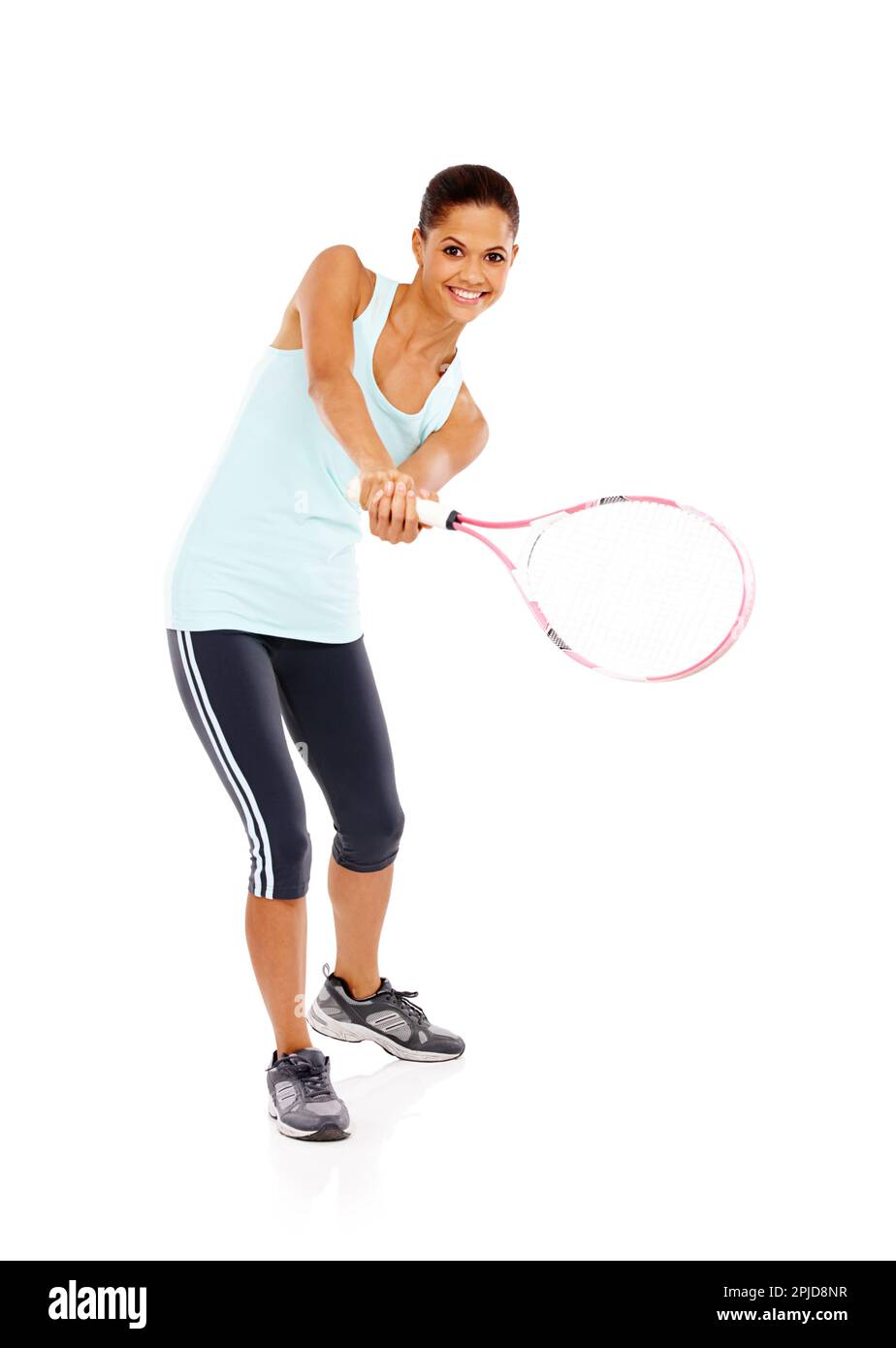 Returning your serve. Full length portrait of a happy young woman ready ...