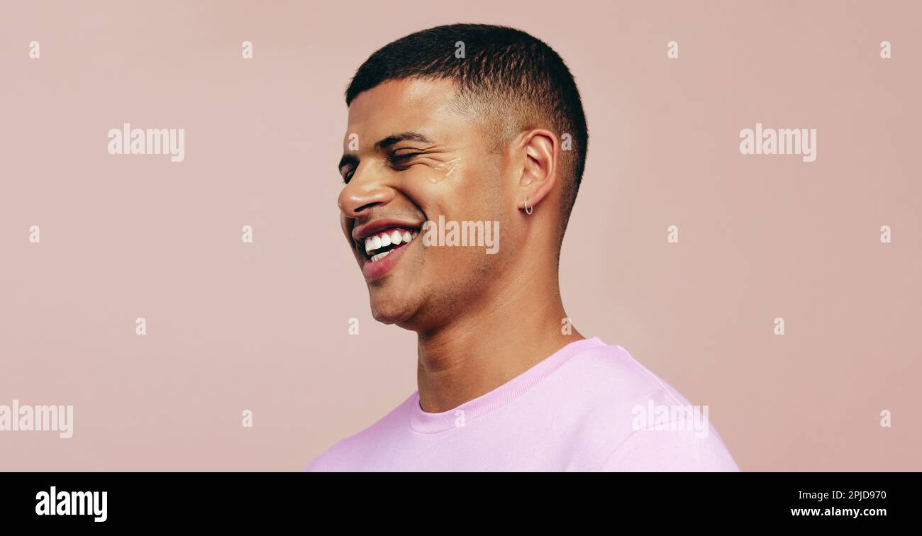 Handsome young man embodying modern masculinity, displaying the results ...