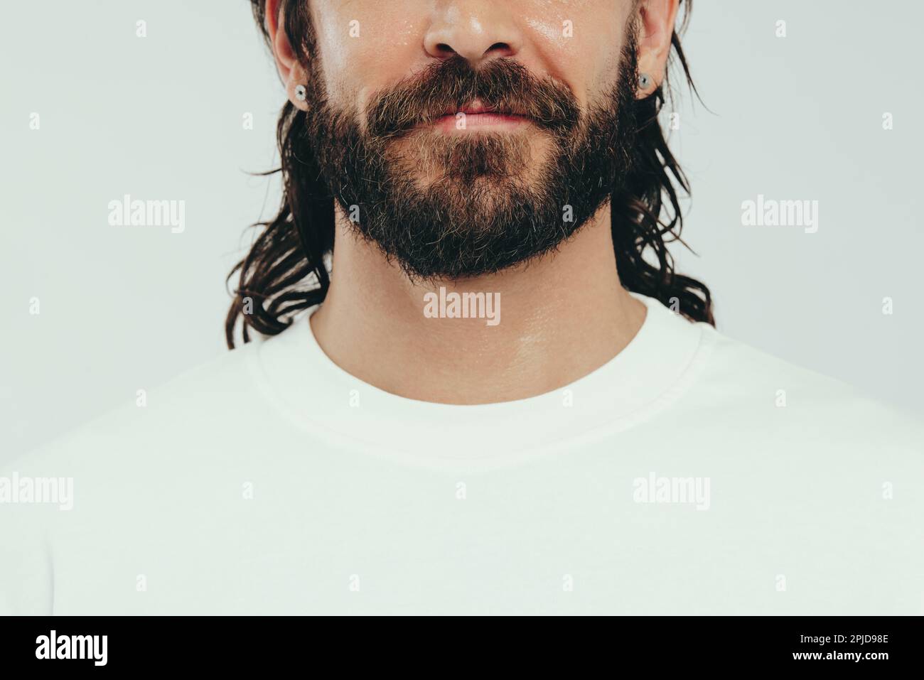 Unrecognizable young man standing in a studio, confidently rocking a ...