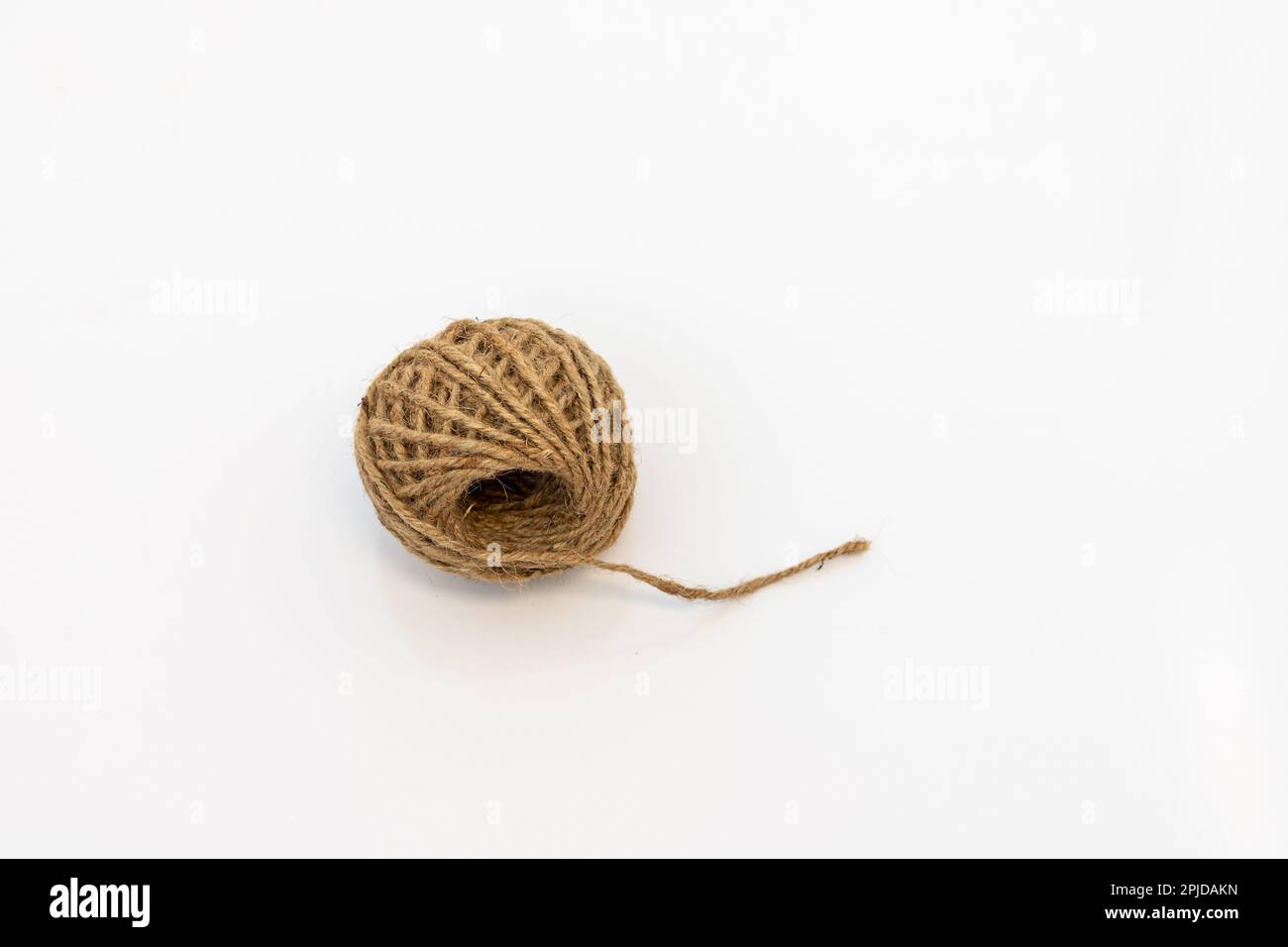 Jute rope bundle closeup isolated over white background Stock Photo - Alamy