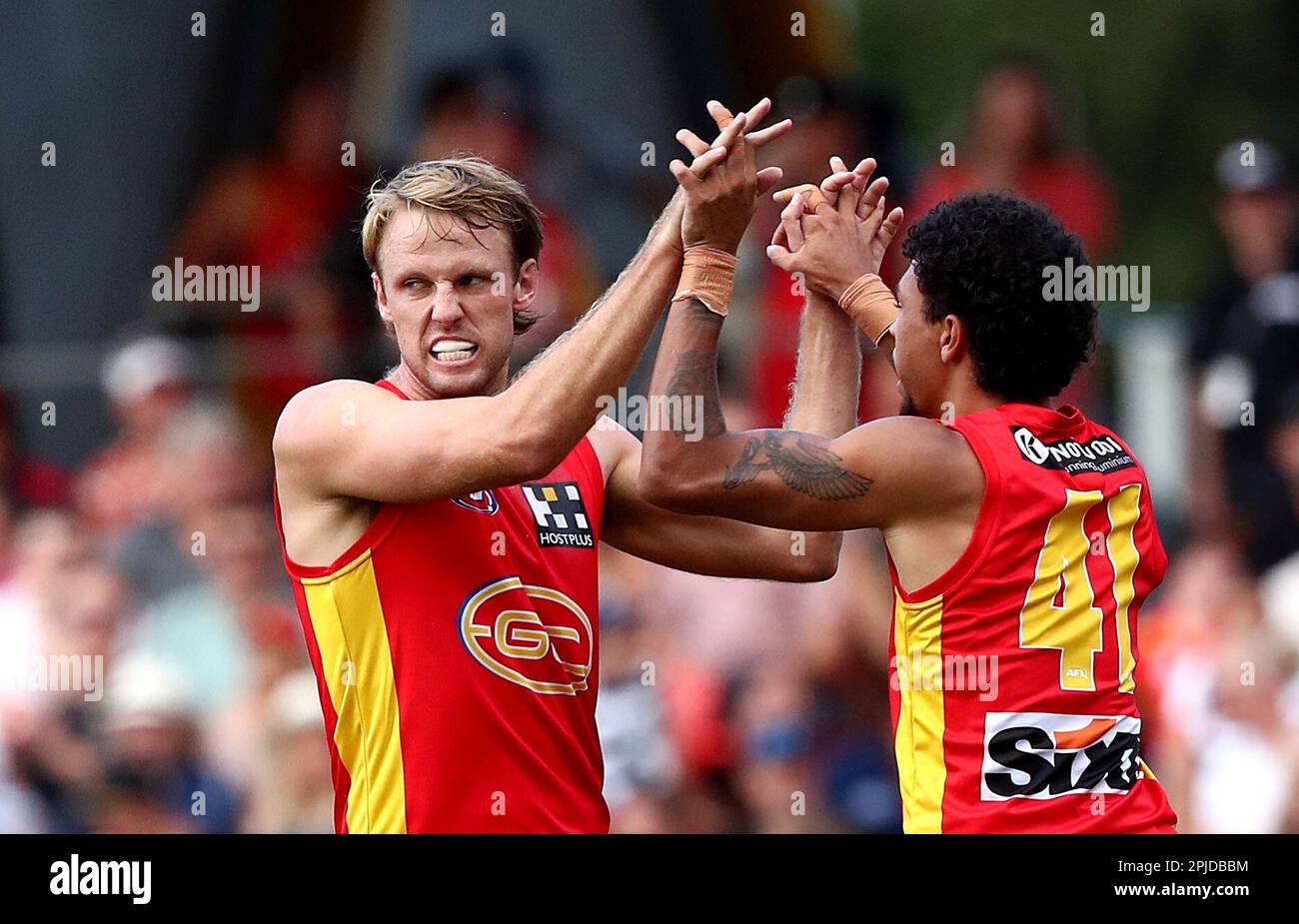 Jack Lukosius of the Suns celebrates a goal during the AFL Round 3 ...